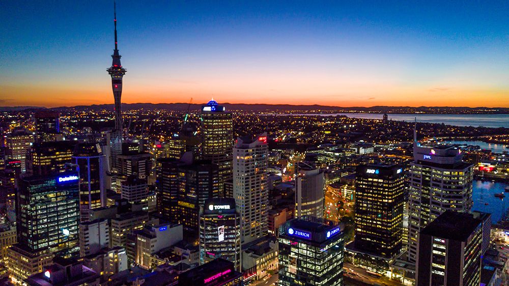 Auckland-New Zealand. The Auckland Skytower and harbor at night ...